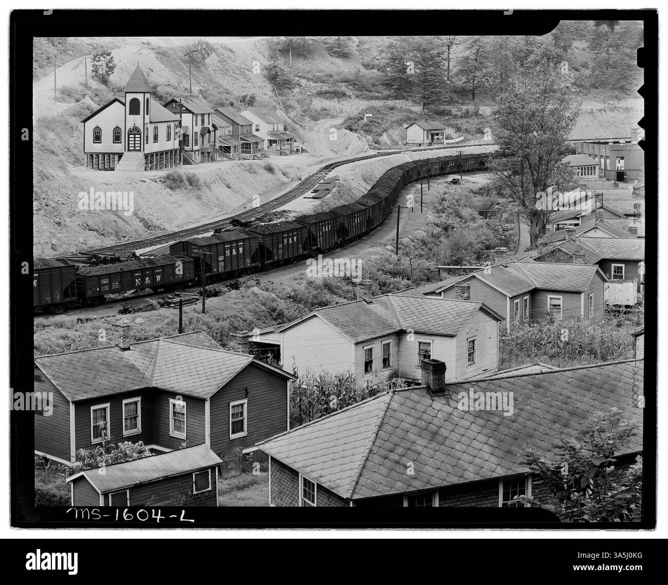An image showcasing houses, coal cars, and a church near U.S. Coal and ...