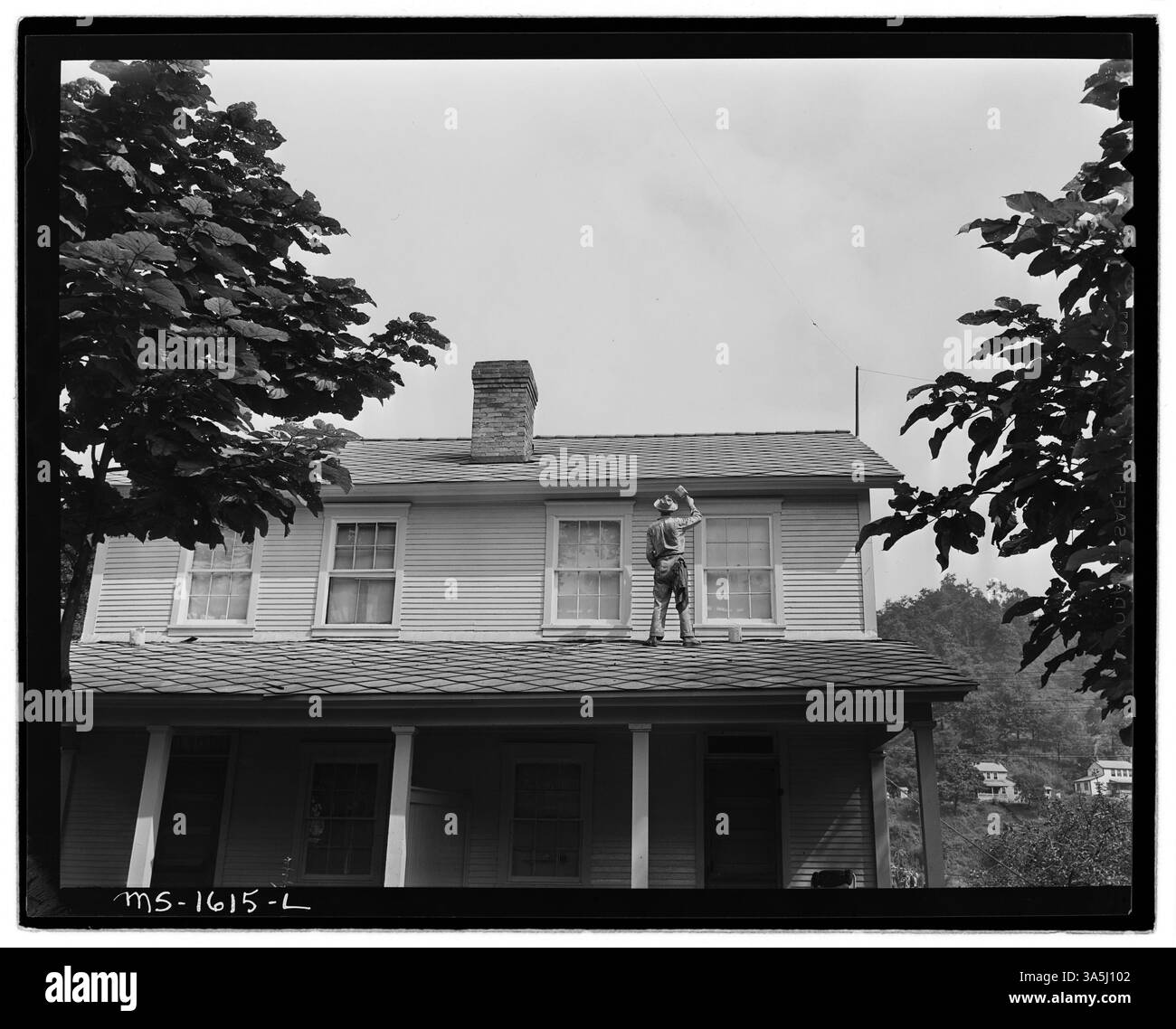 This image shows a company-employed painter working on a company-owned ...
