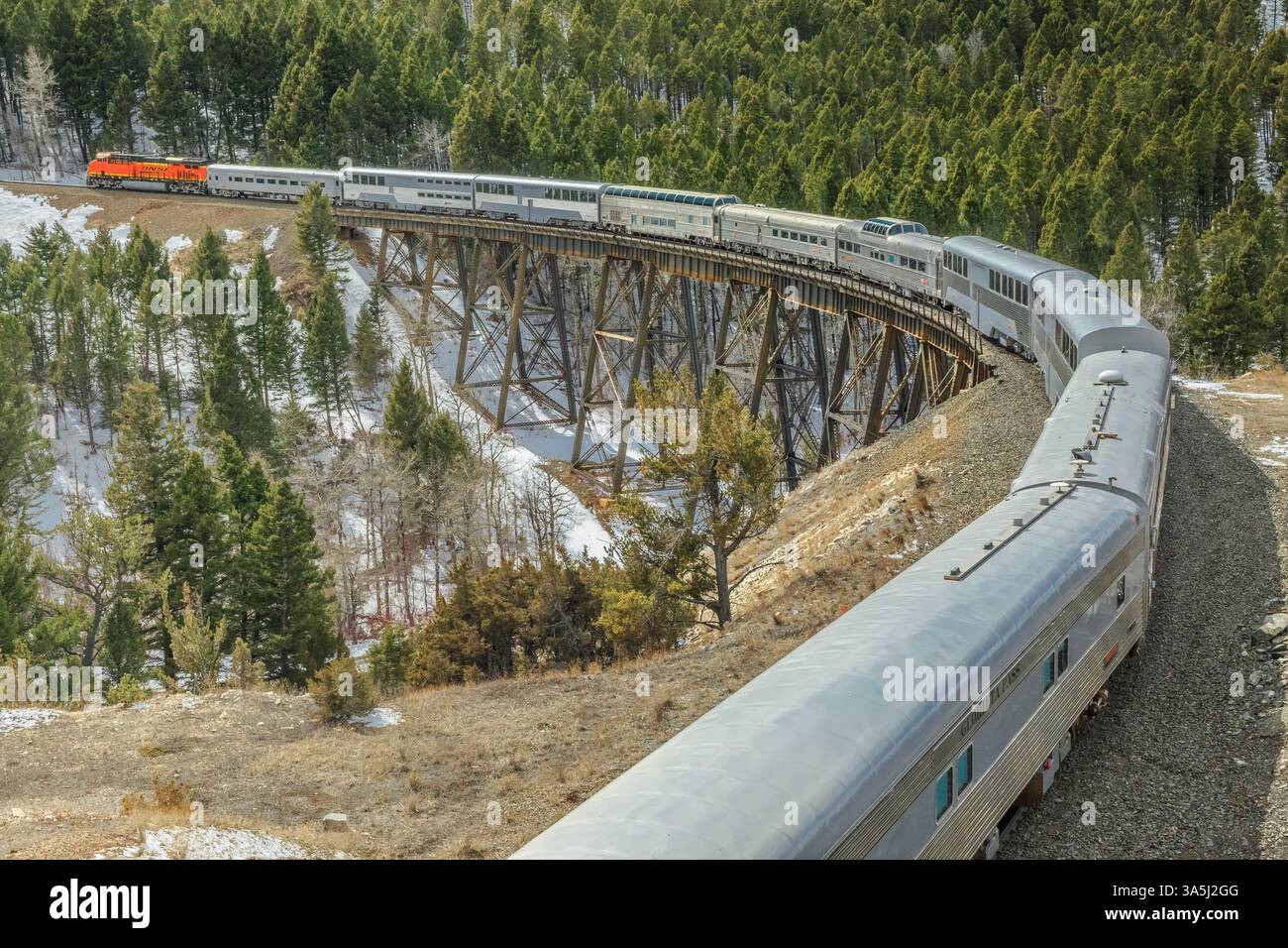 passenger train heading from mullan pass over a trestle near austin ...