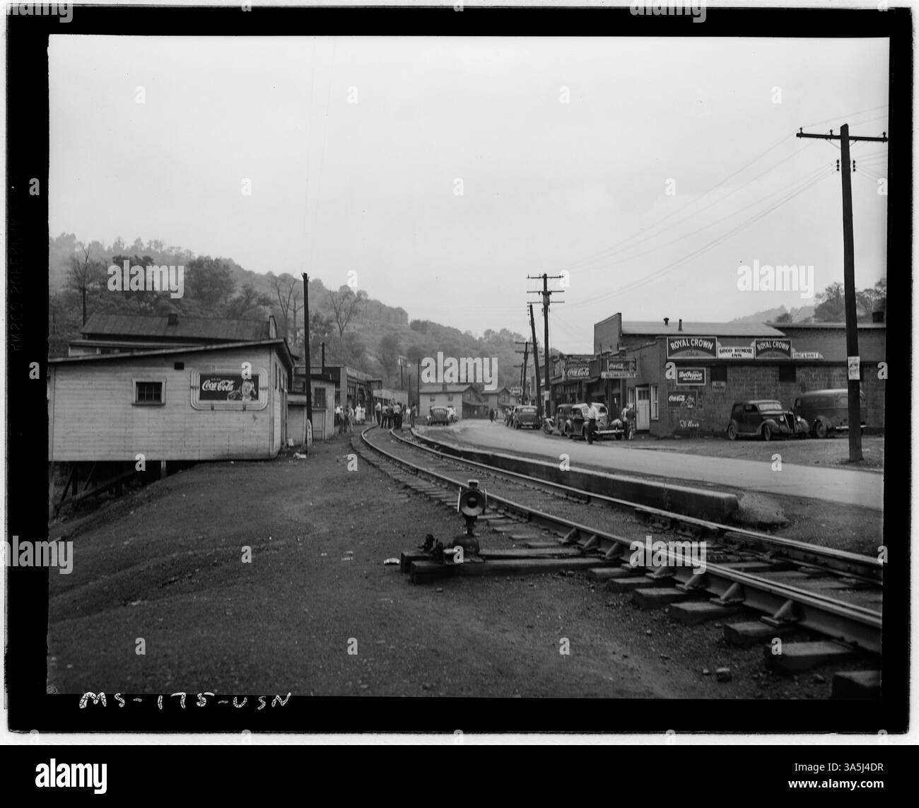 This 1946 photograph depicts a street scene in Osage, West Virginia, a ...