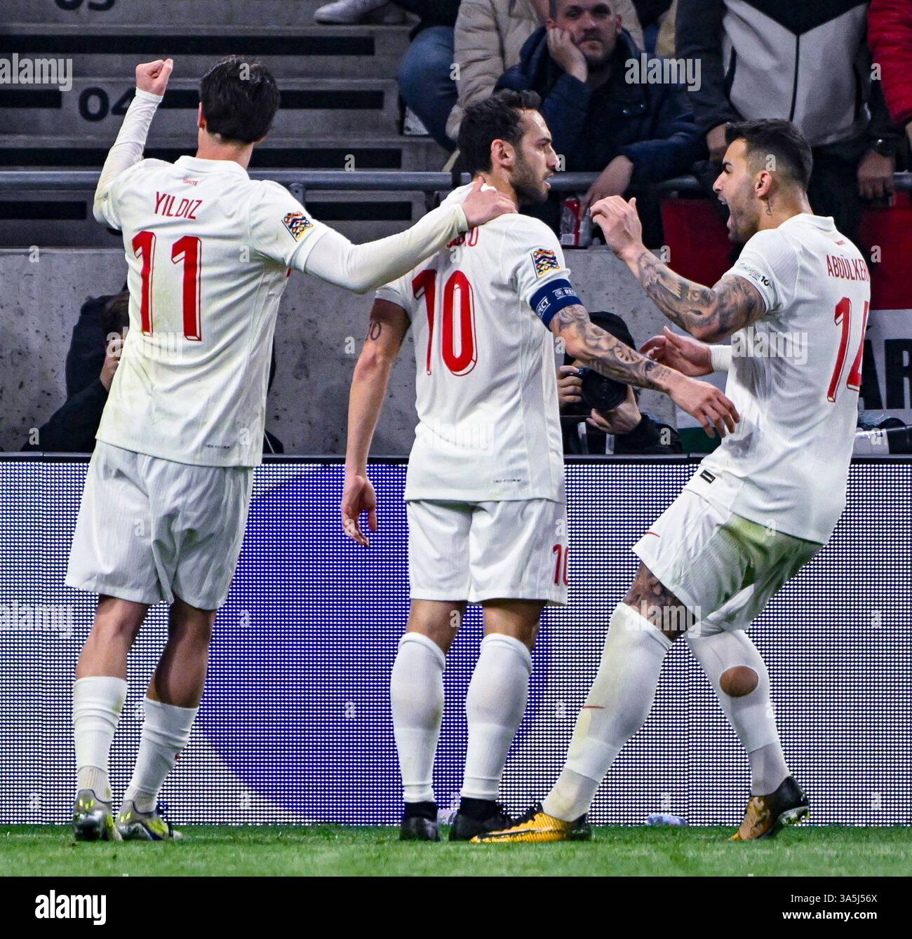 Turkey's Hakan Calhanoglu, center, celebrates with teammates after ...