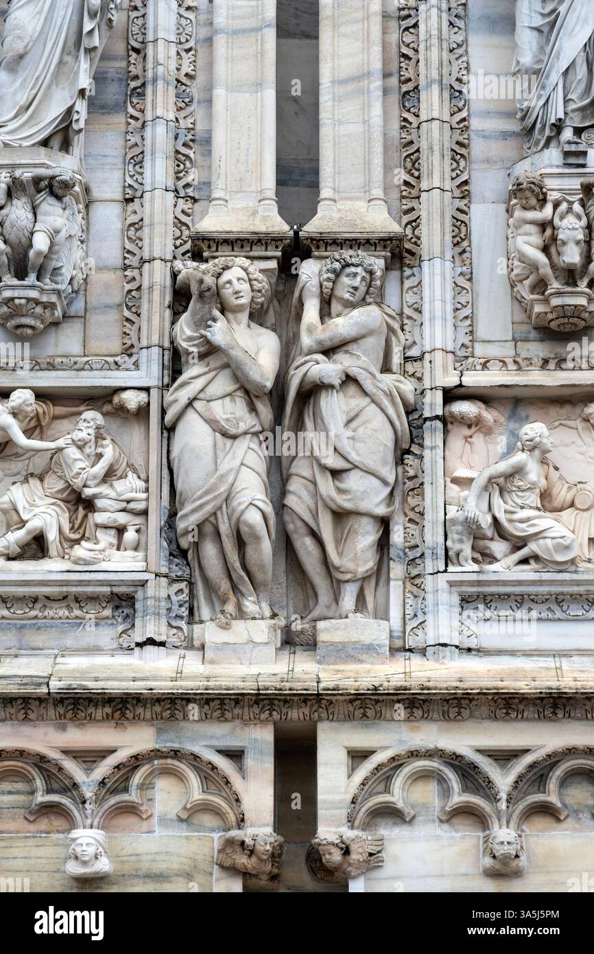 Sculptures of saints and Biblical figures on the facade of the Milan ...