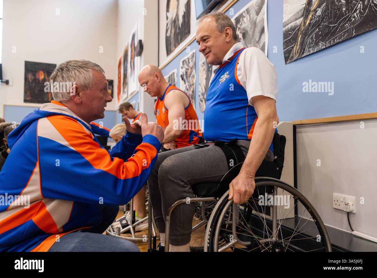 Knaresborough, UK. 23 MAR, 2025. Ed Davey is given a demonstration by ...