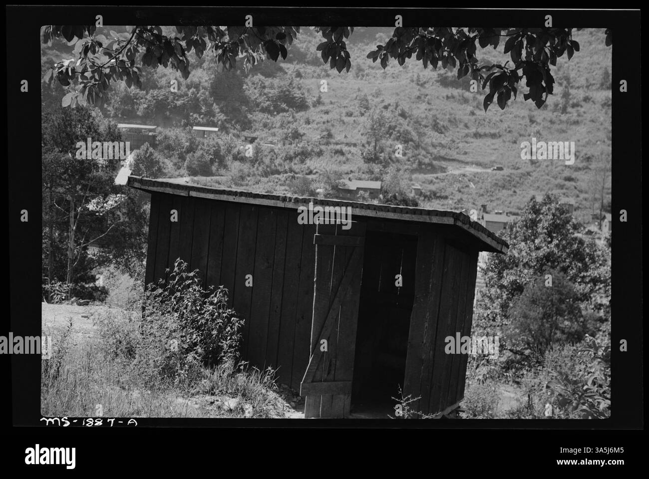 An outdoor pit privy with two seats near Diablock School, located near ...