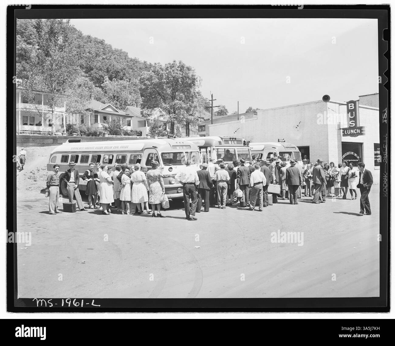 Miners and their families board a bus in War, McDowell County, West ...