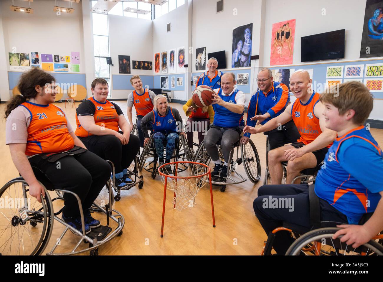 Knaresborough, UK. 23 MAR, 2025. Ed Davey shoots for the basket as the ...