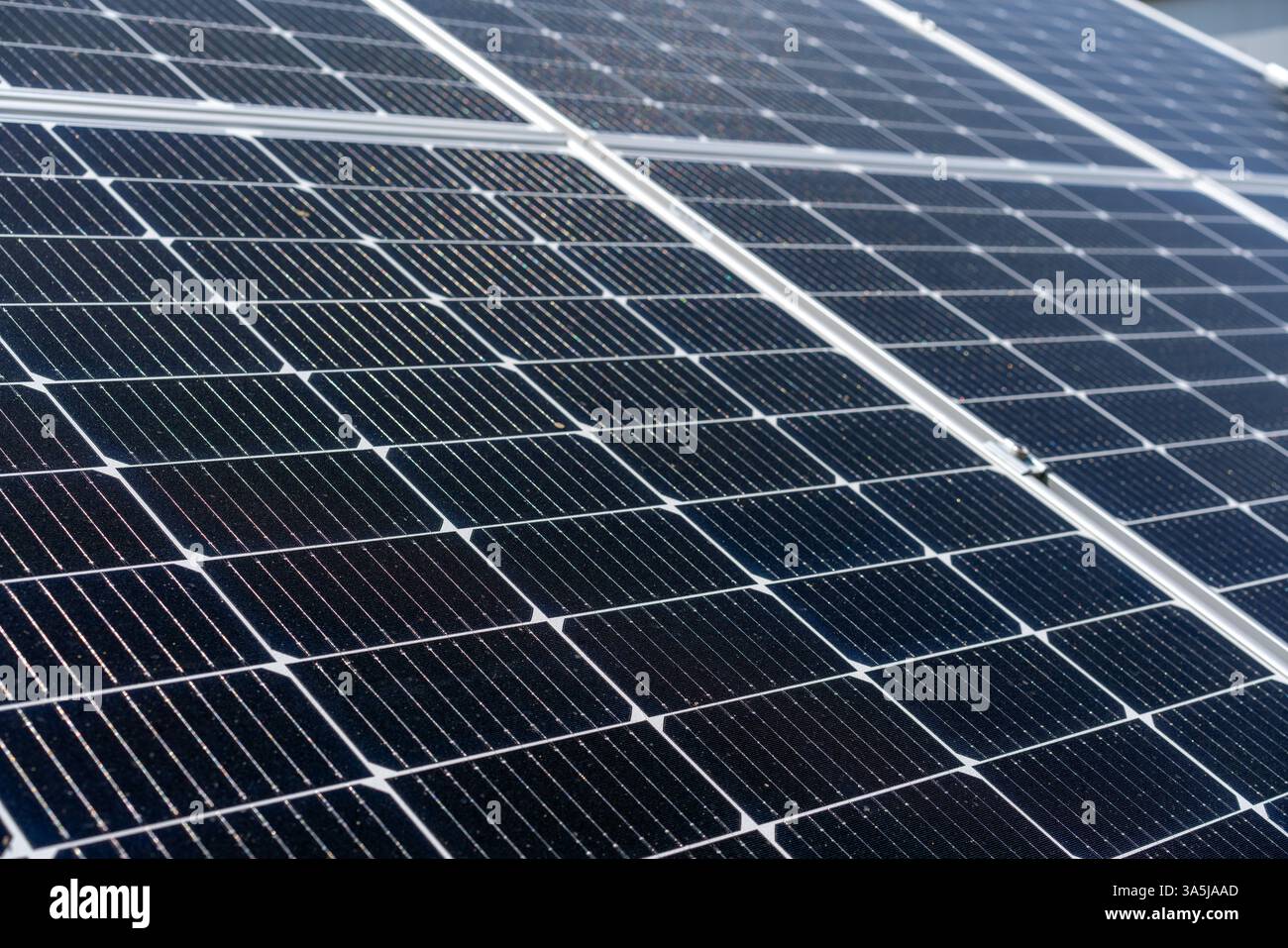 Closeup diagonal view photo of black surface of solar panel Stock Photo ...