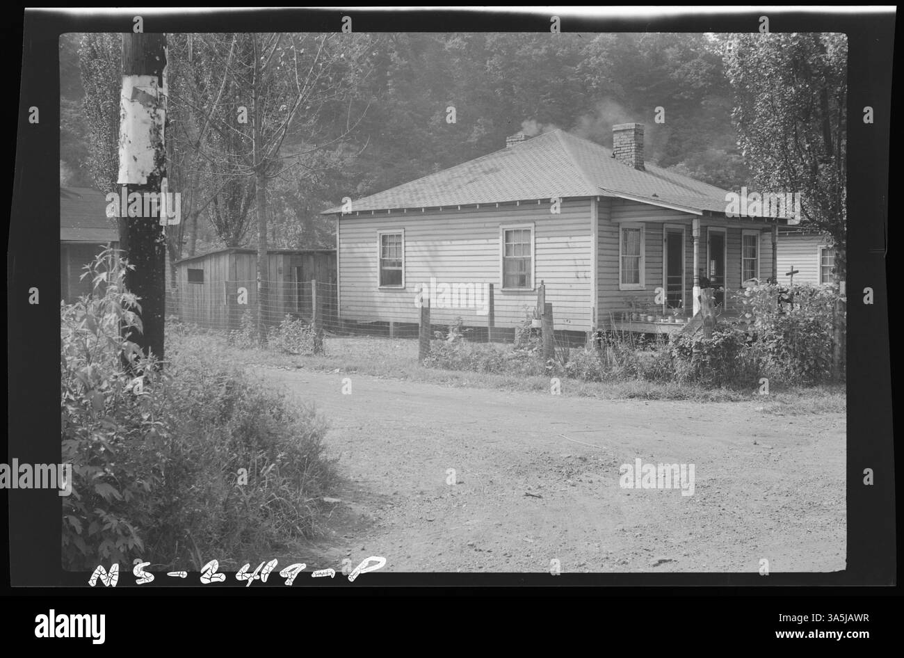 The front view of a house (#2 surveyed) and others alongside at Algoma ...