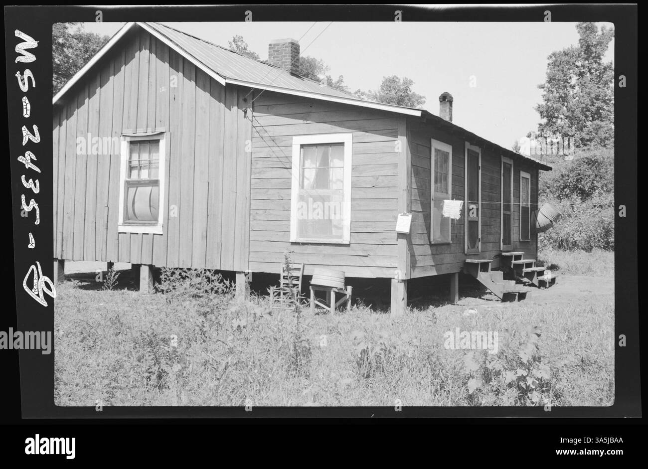A photograph depicting a house in a mining community, capturing the ...