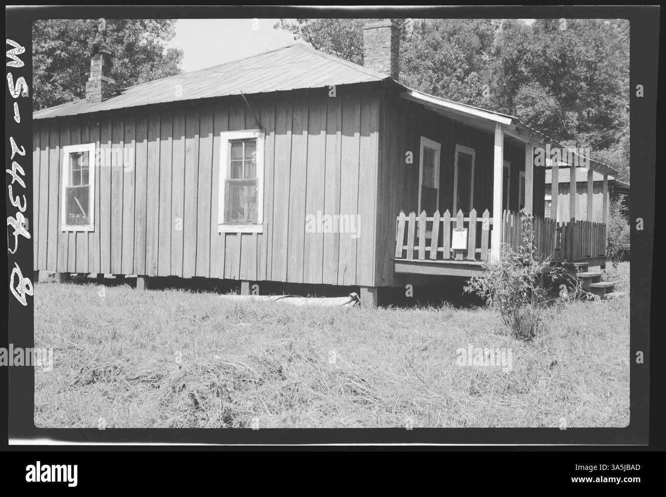 A photograph shows a house in a mining community from 1946. The image ...