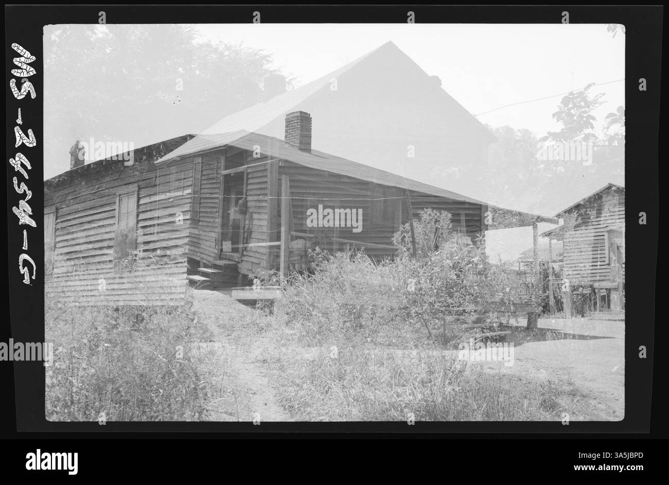 A photograph of a house in a mining community, depicting the living ...