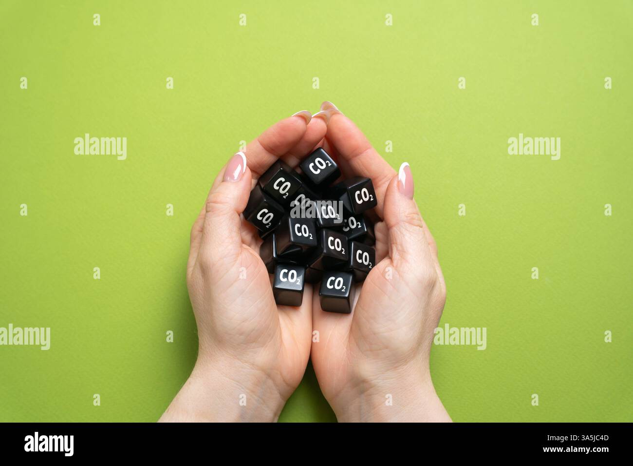 CO2 cubes in hands. Personal carbon footprint. Individual carbon ...