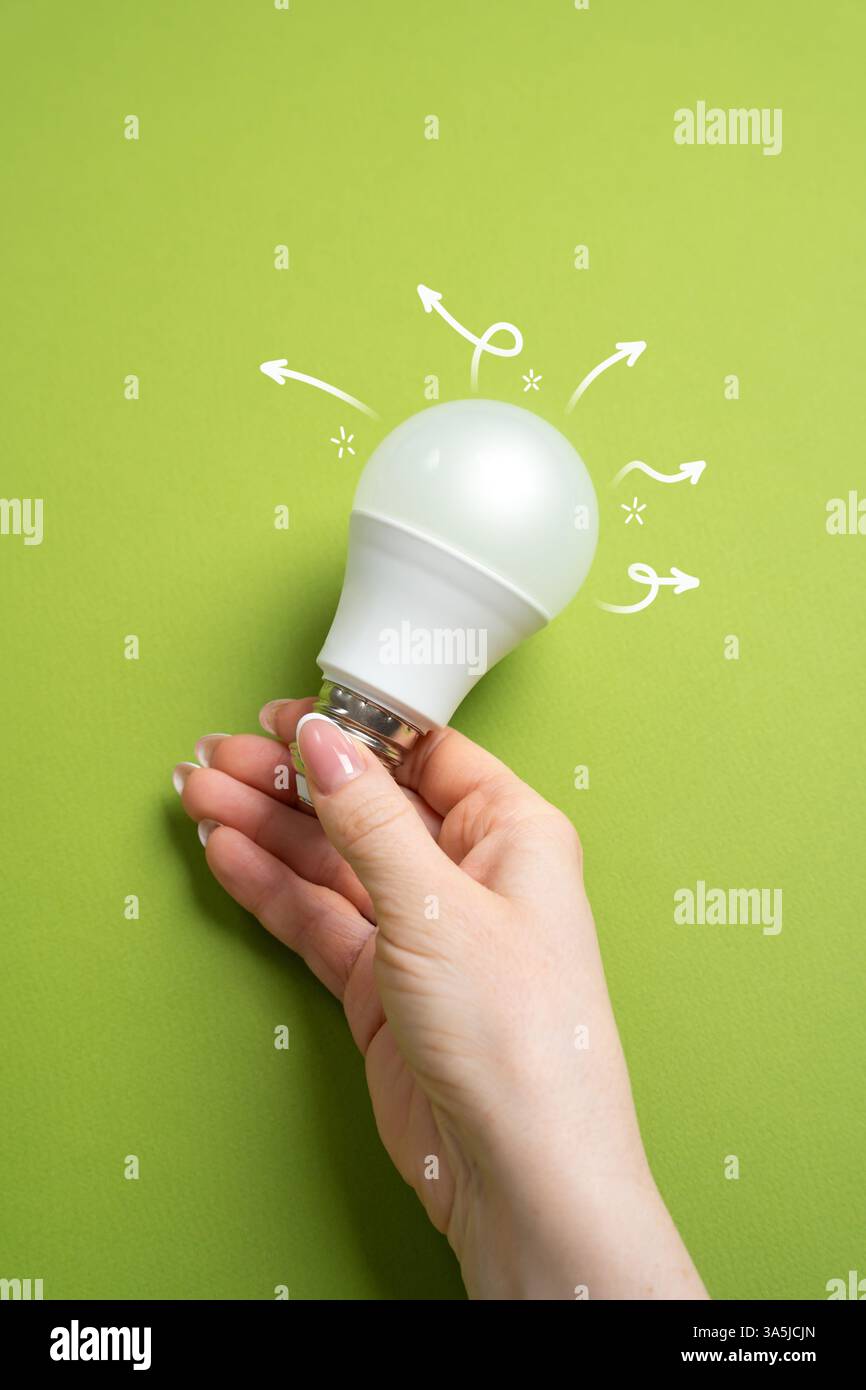 Idea and motivation for development. Light bulb in hand. Creativity ...