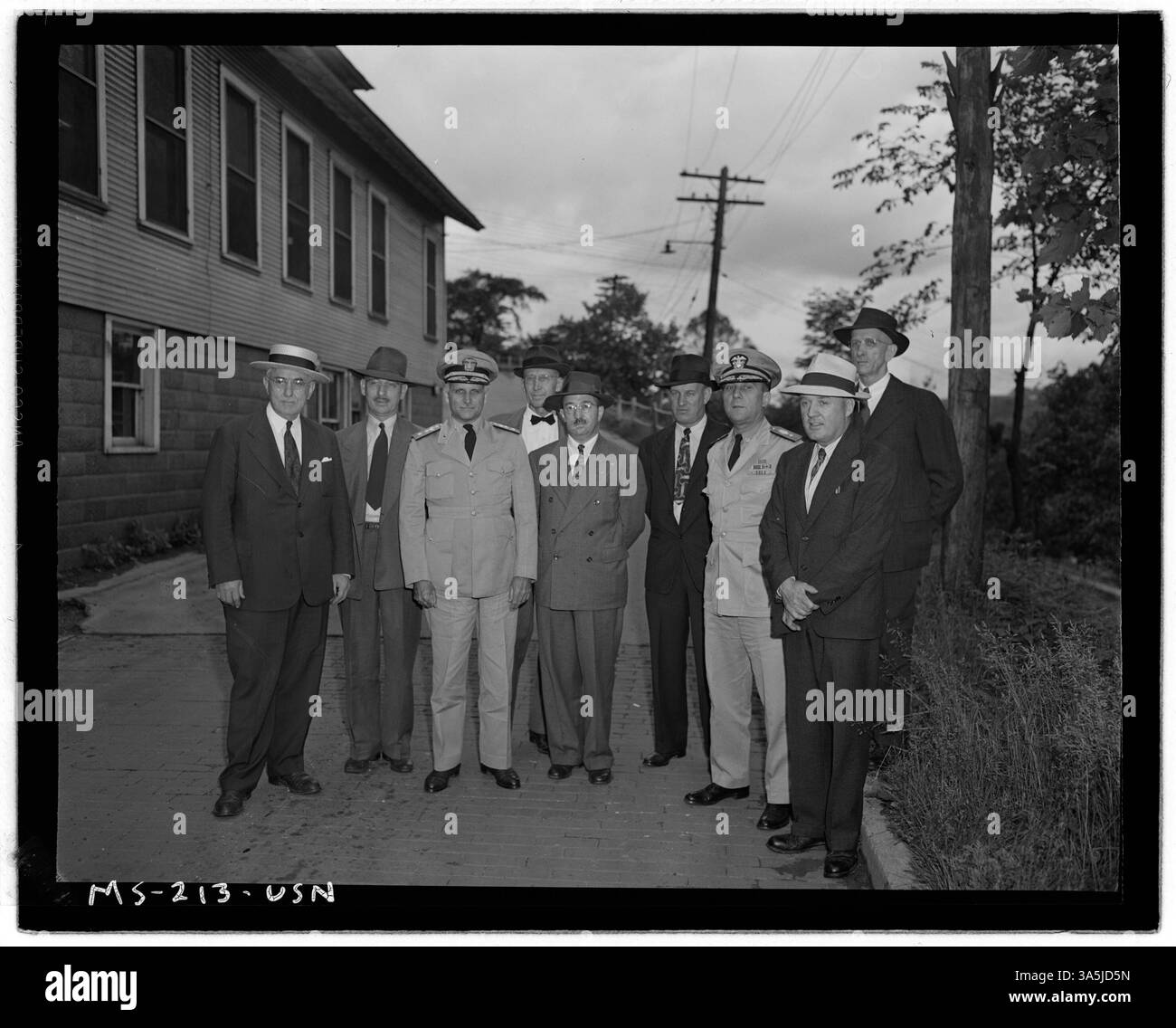Admiral Boone and Commodore Dickeman are seen with a group of mining ...