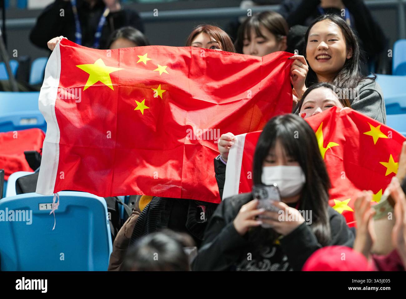 BEIJING, CHINA - MARCH 16: Chinese fans with the Chinese flag during ...