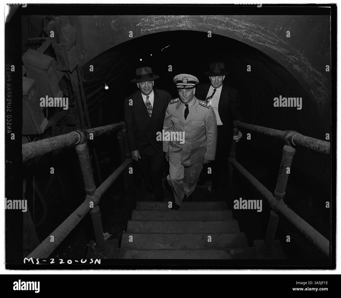 Mr. M. Honis, Admiral Boone, and Alec Grant ascend the main slope ...