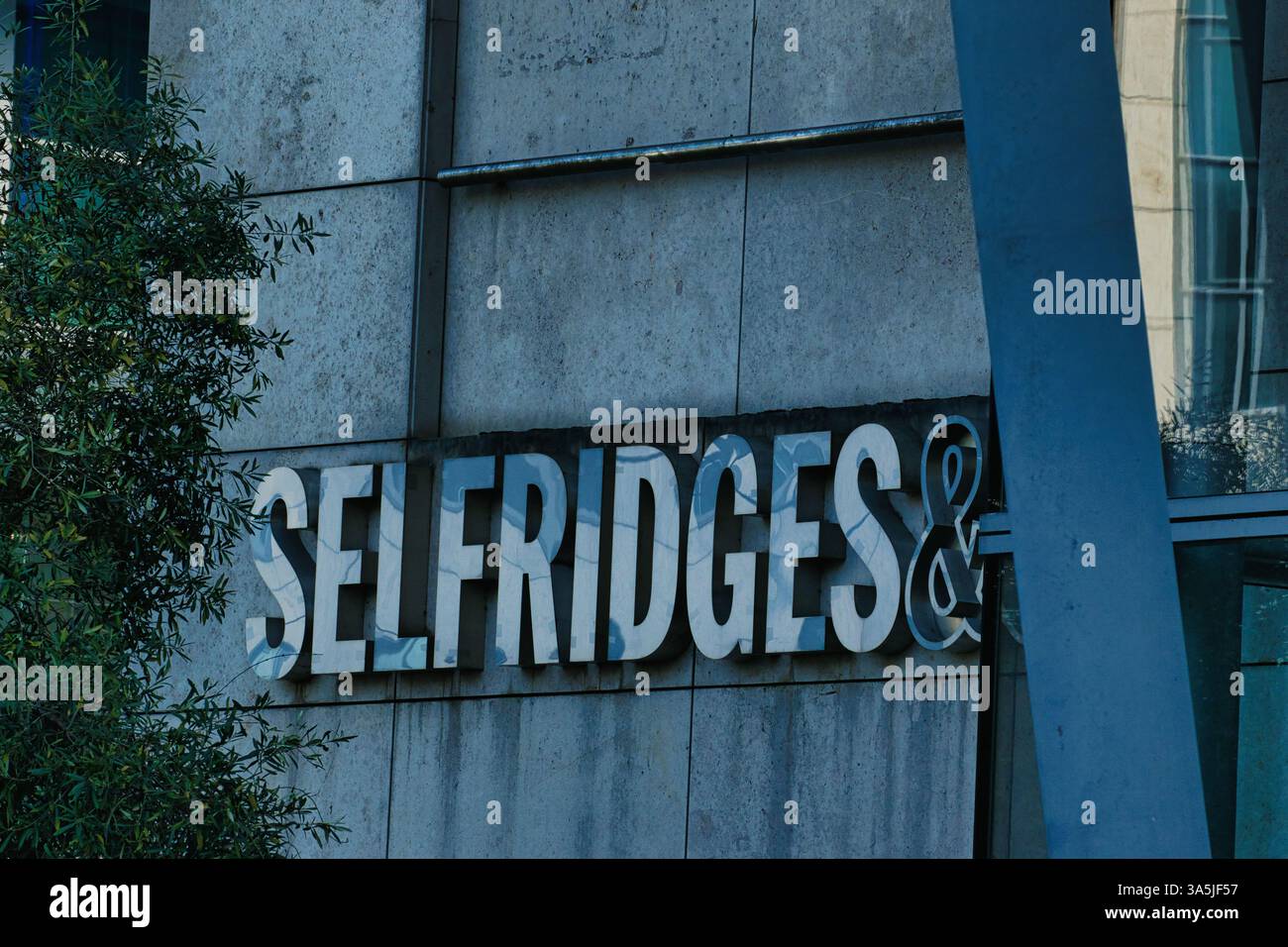Exterior shot of the Selfridges & Co. sign on a stone building ...