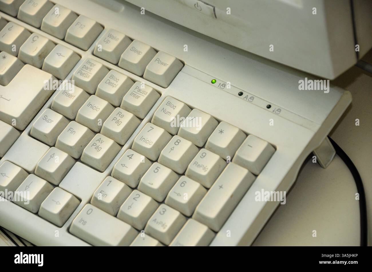 Old computer keyboard with worn keys highlighting vintage technology ...