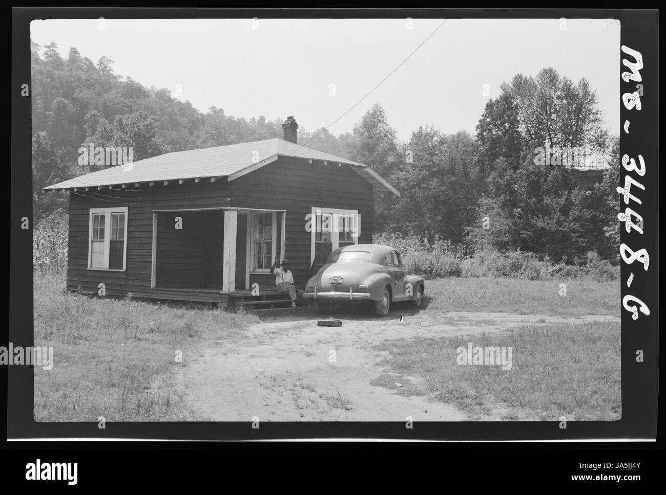 This photograph shows a house in a mining community, capturing the ...