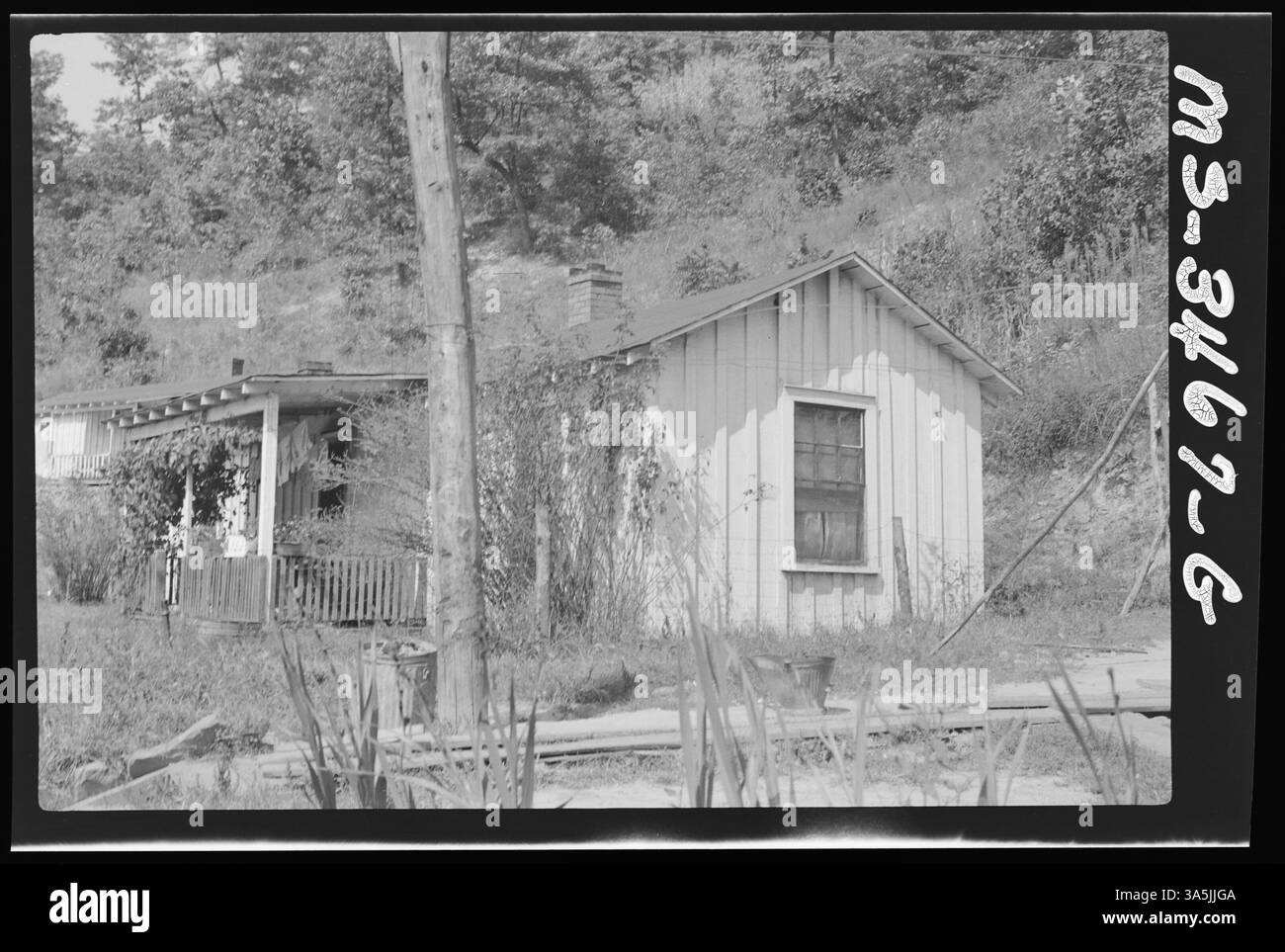 A photograph of a house in a mining community, depicting typical ...