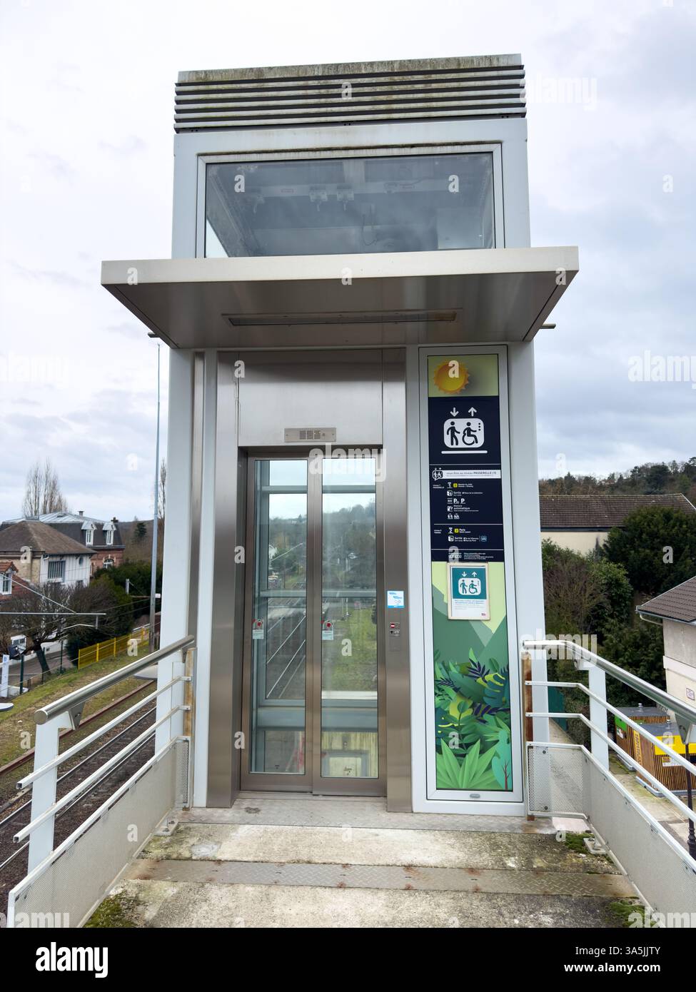 Elevator tower at suburban train station offering accessibility to ...