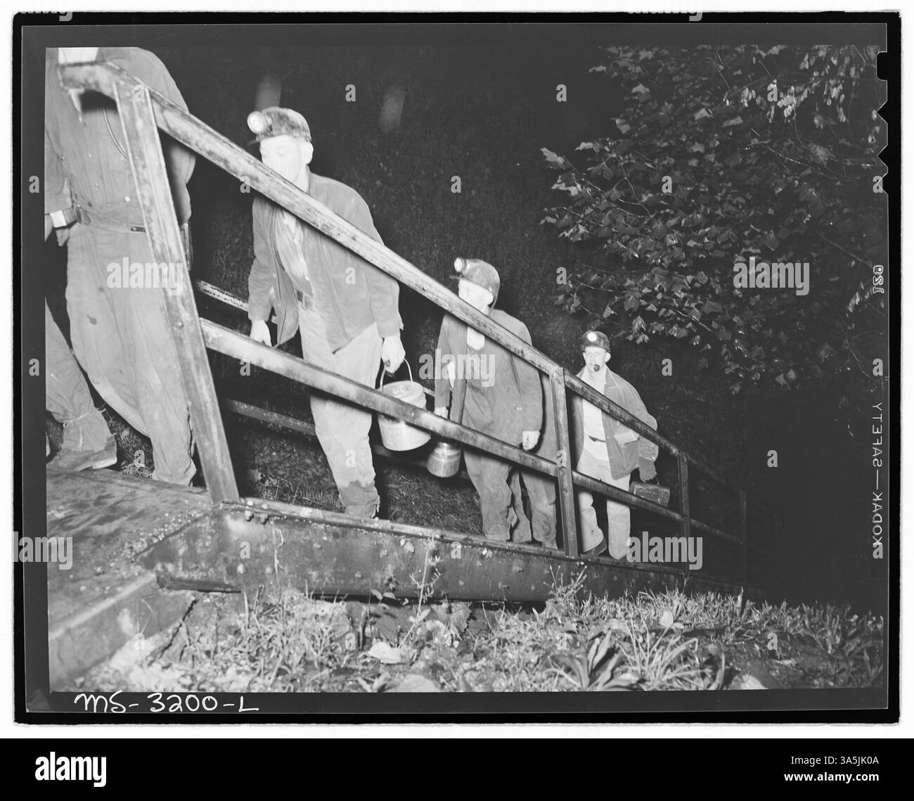 A miner, Miers, climbs the stairs to the mantrip station at Inland ...