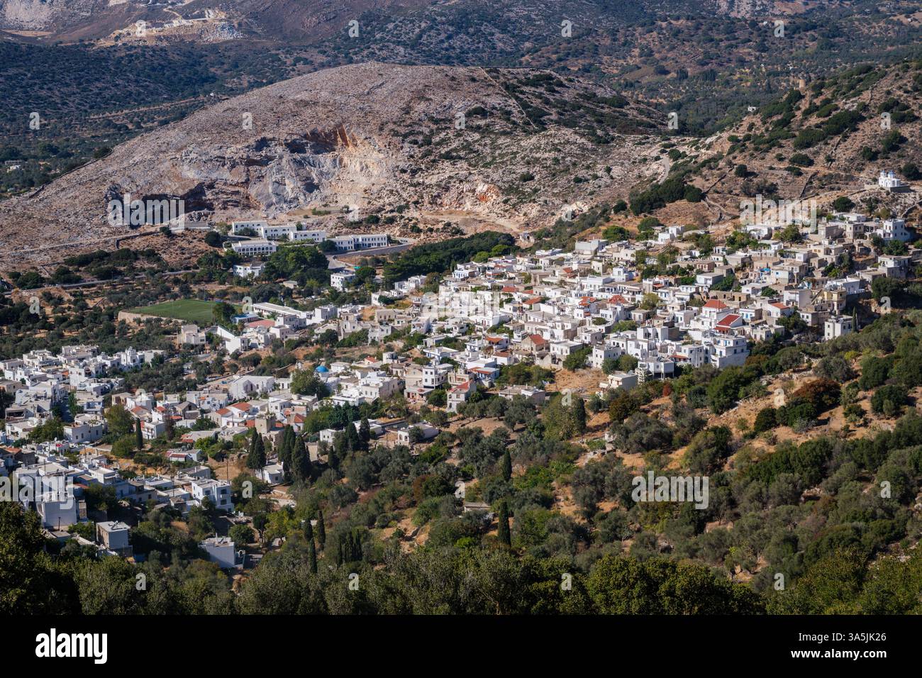 Elevated view of the traditional Filoti village nestled on the hillside ...