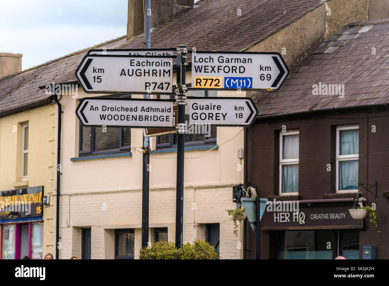 Road signs at the Main Street roundabout in Arklow, Ireland, with ...