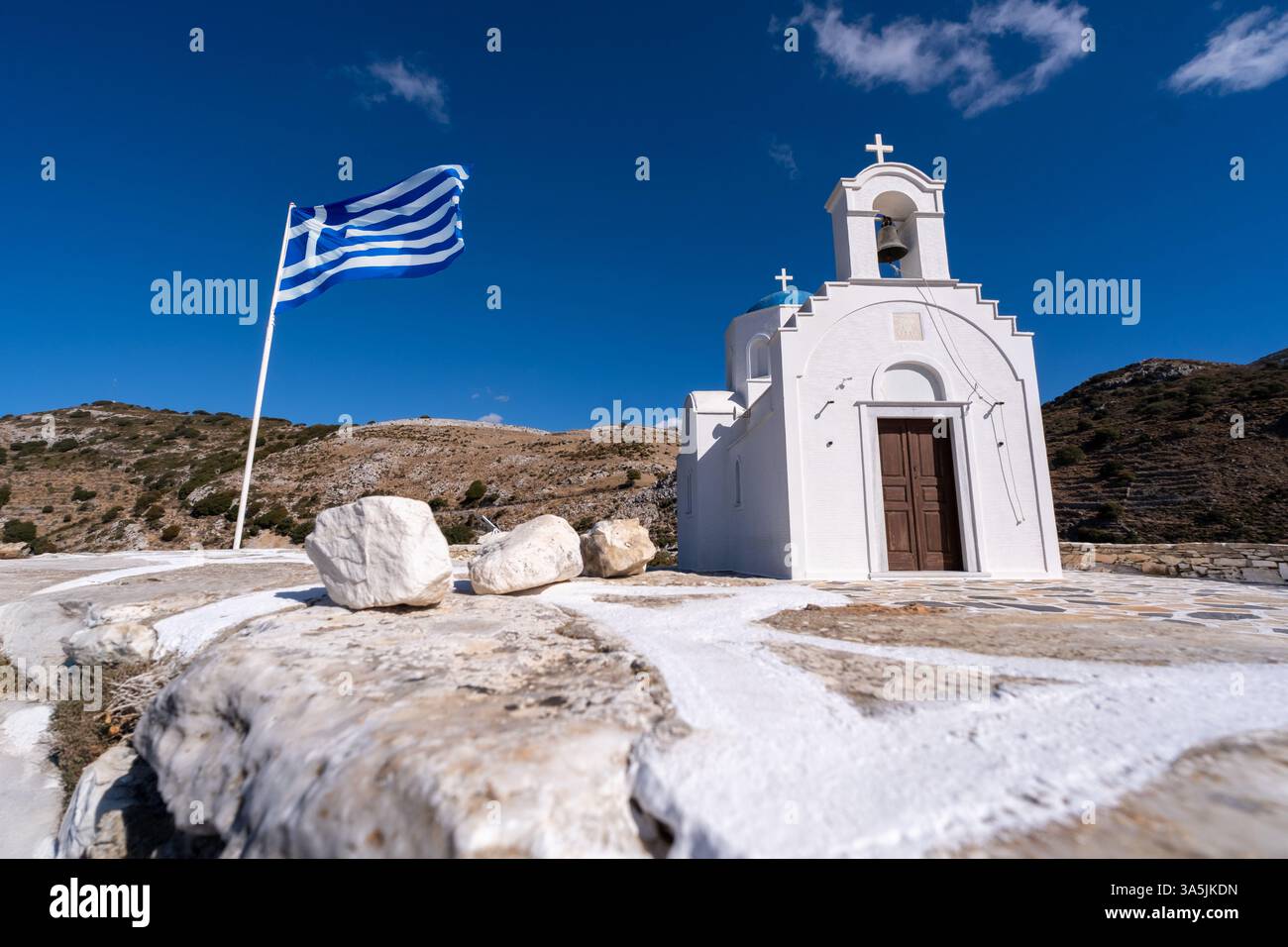 White Orthodox Church of Prophet Elias with Greek flag in Naxos Stock ...