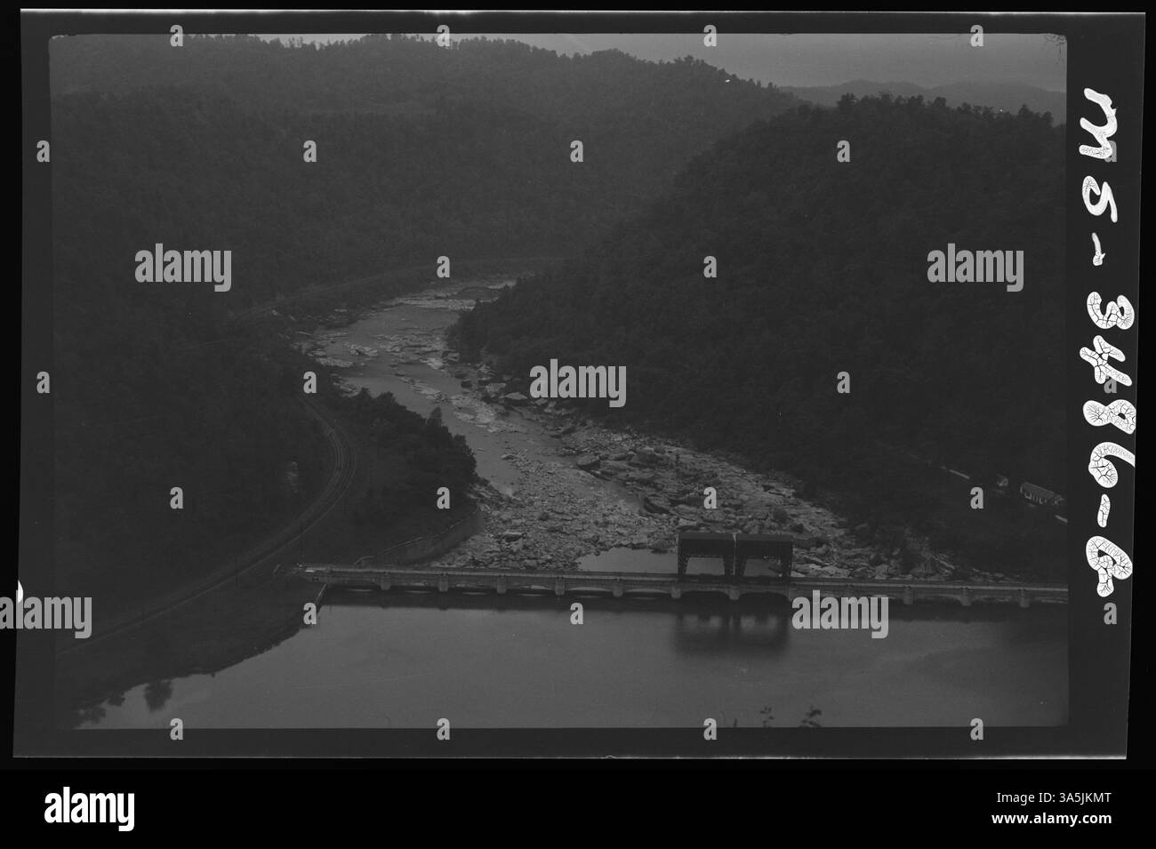 A 1946 photograph showcasing a river valley and bridge, illustrating ...