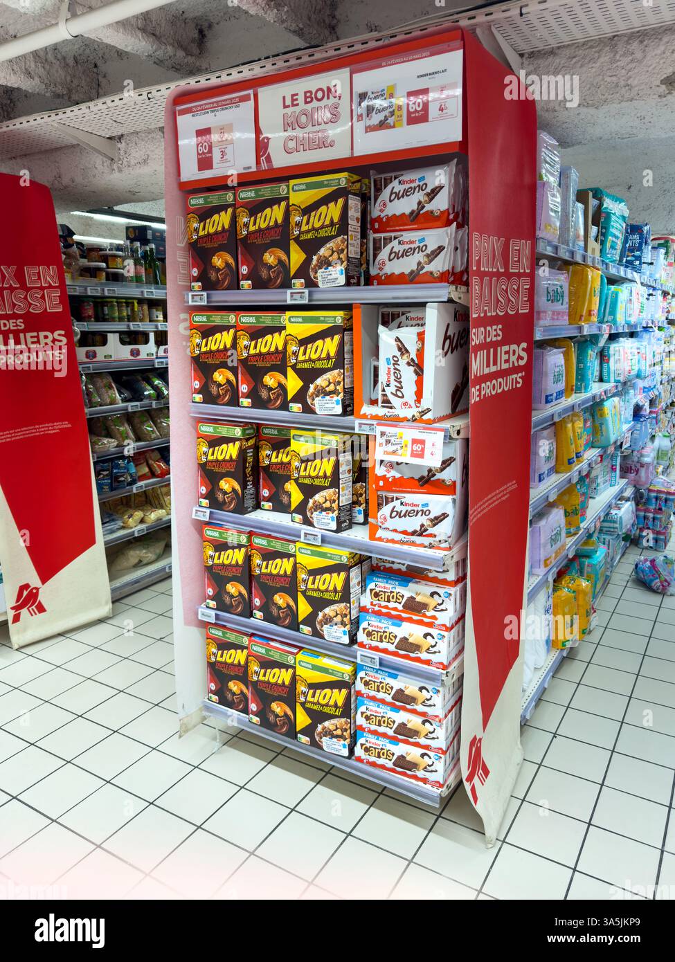 Shelves filled with colorful cereal boxes showcasing various flavors ...