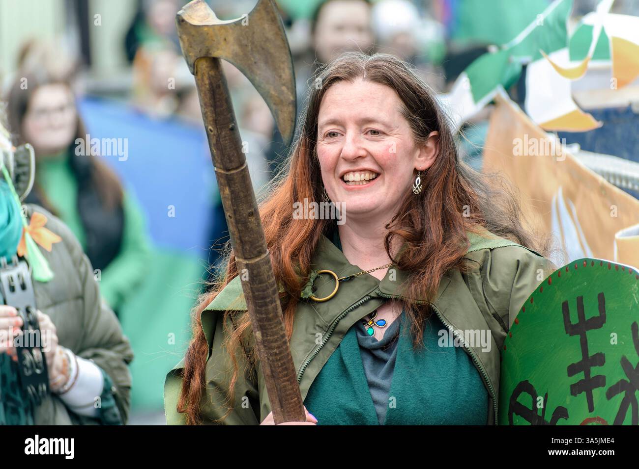 St. Patrick Parade. Arklow, Ireland. 2025 A cheerful woman in an Irish ...