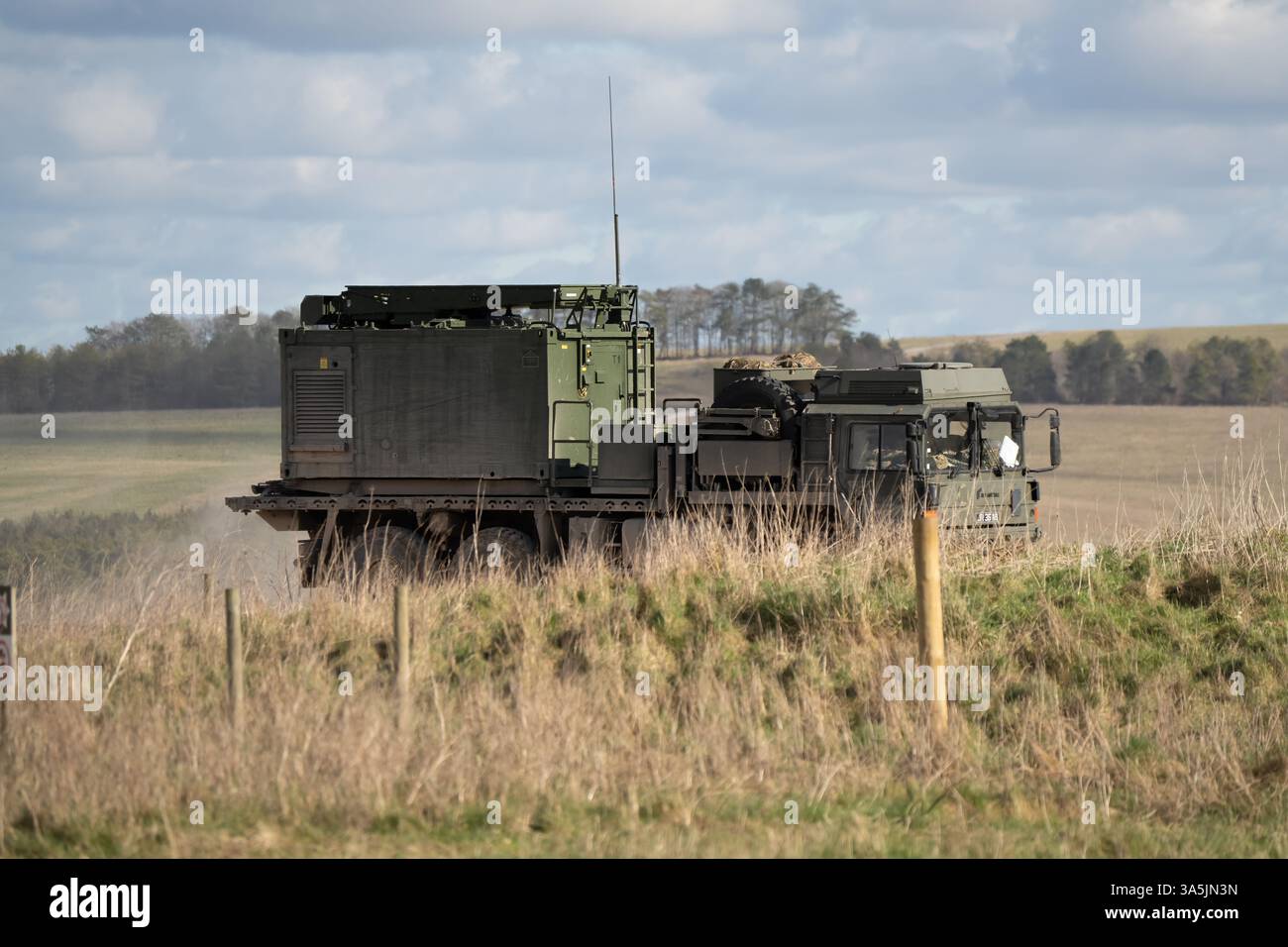 British army MAN SV HX 60 6x6 18.330 platform truck, loaded with a ...
