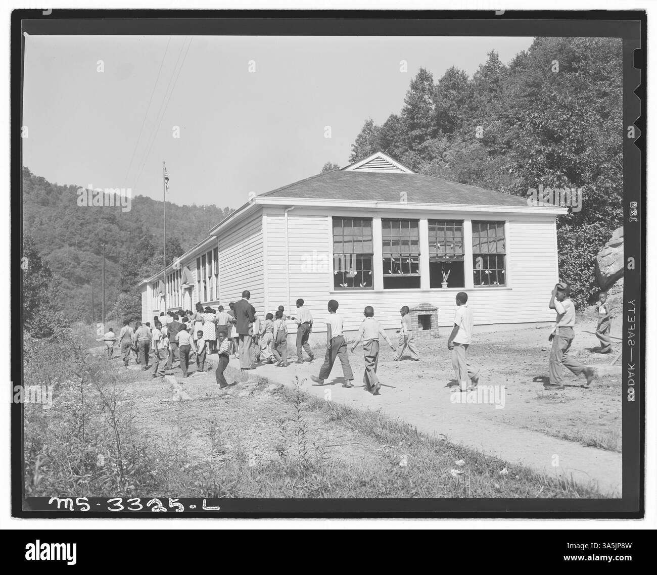 This image captures children returning to school after recess at Inland ...