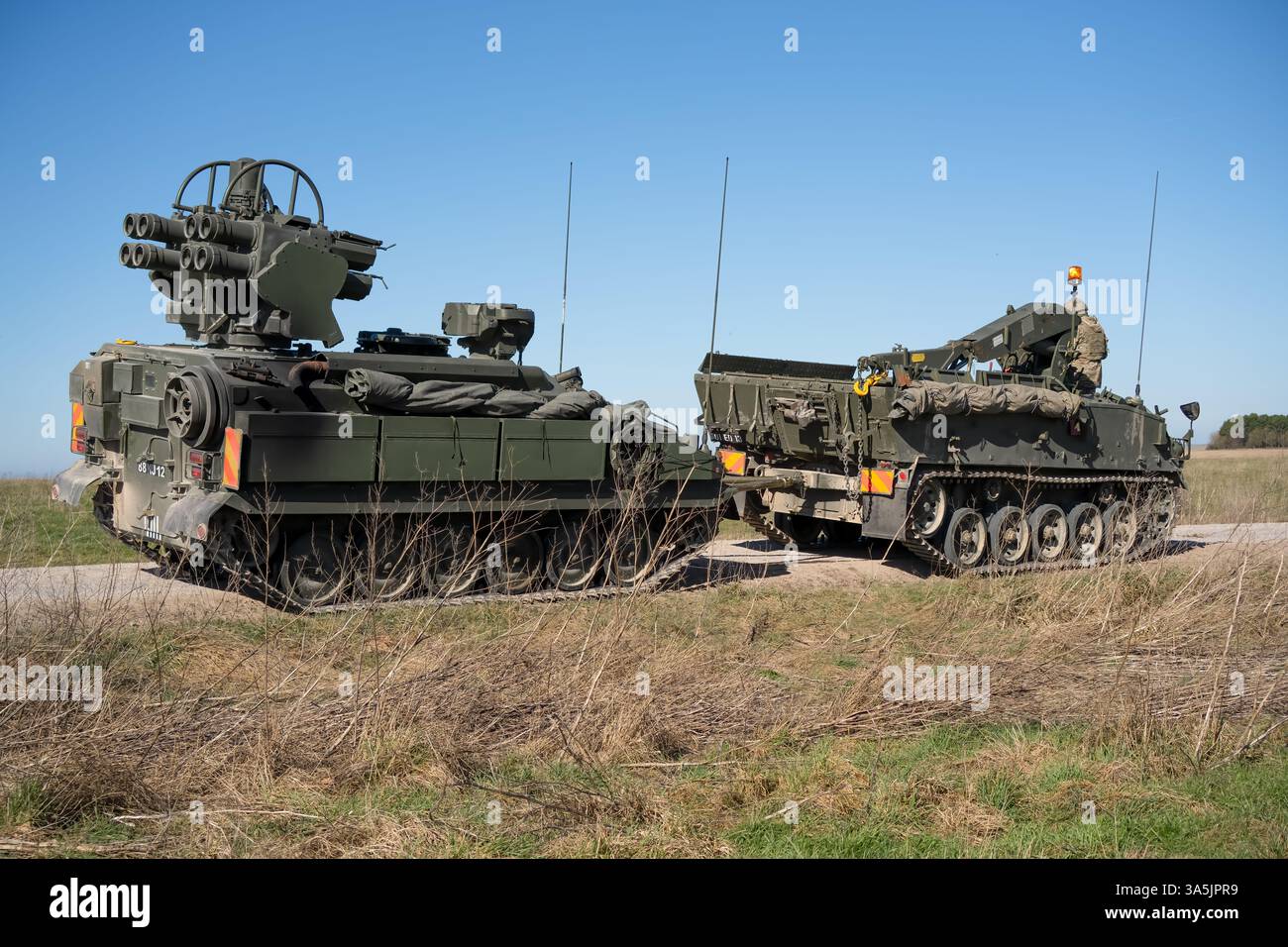 British Army Bulldog FV434 MRV towing a stricken Alvis Stormer ...