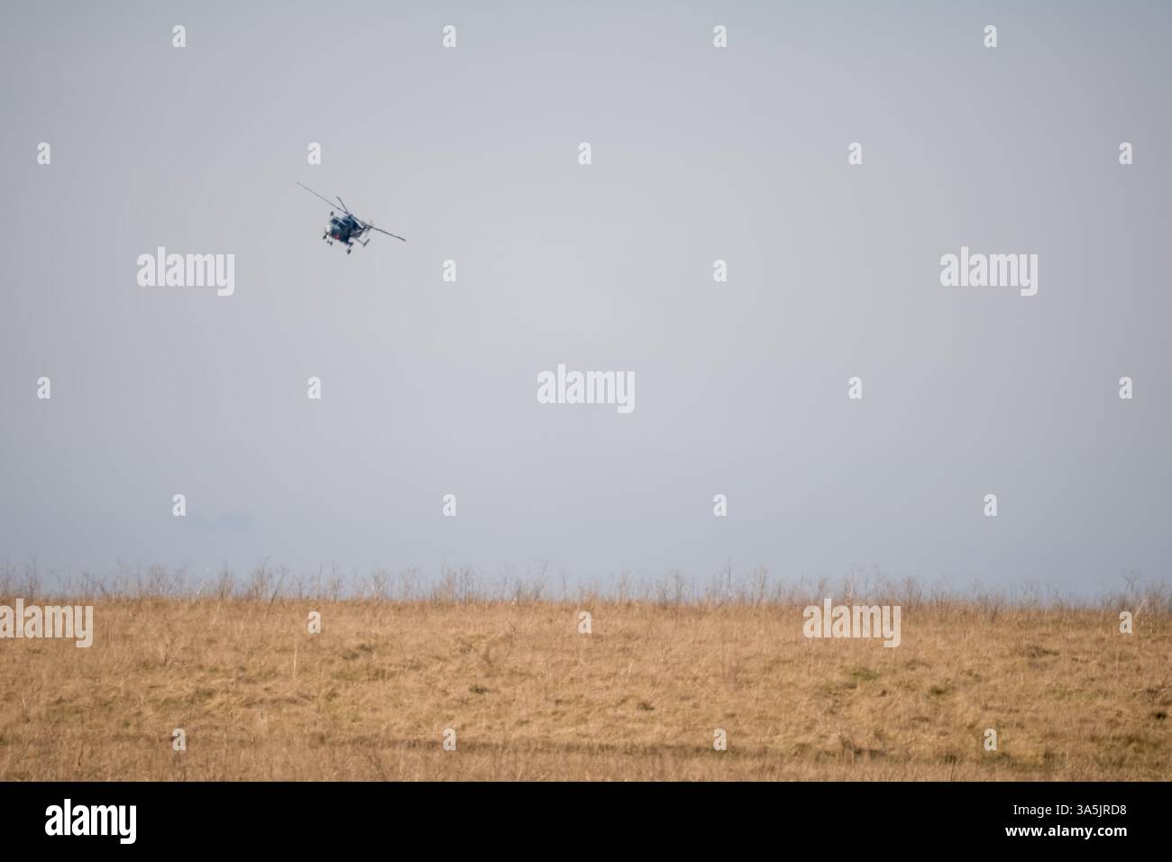 British army AgustaWestland AW159 Wildcat AH1 helicopter flying over ...