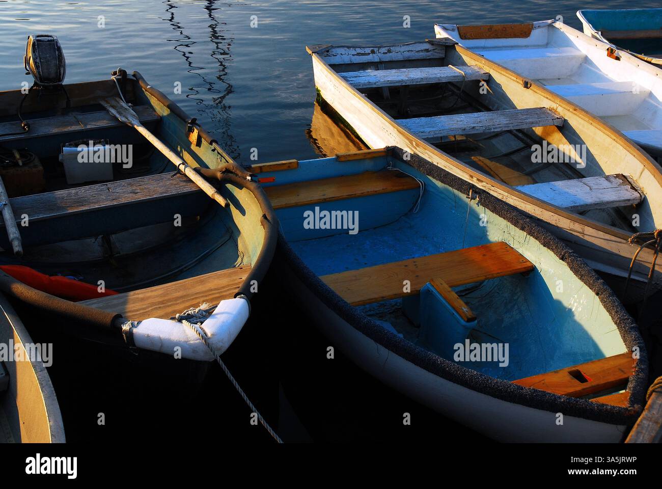 Small dinghies are tied to a dock Stock Photo - Alamy
