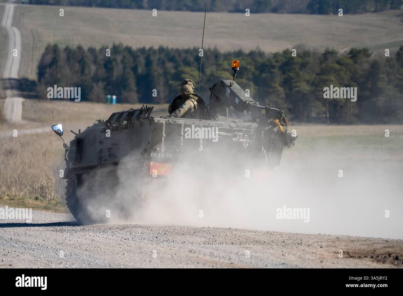 British army FV434 mechanized Armoured Repair Vehicle moving along a ...