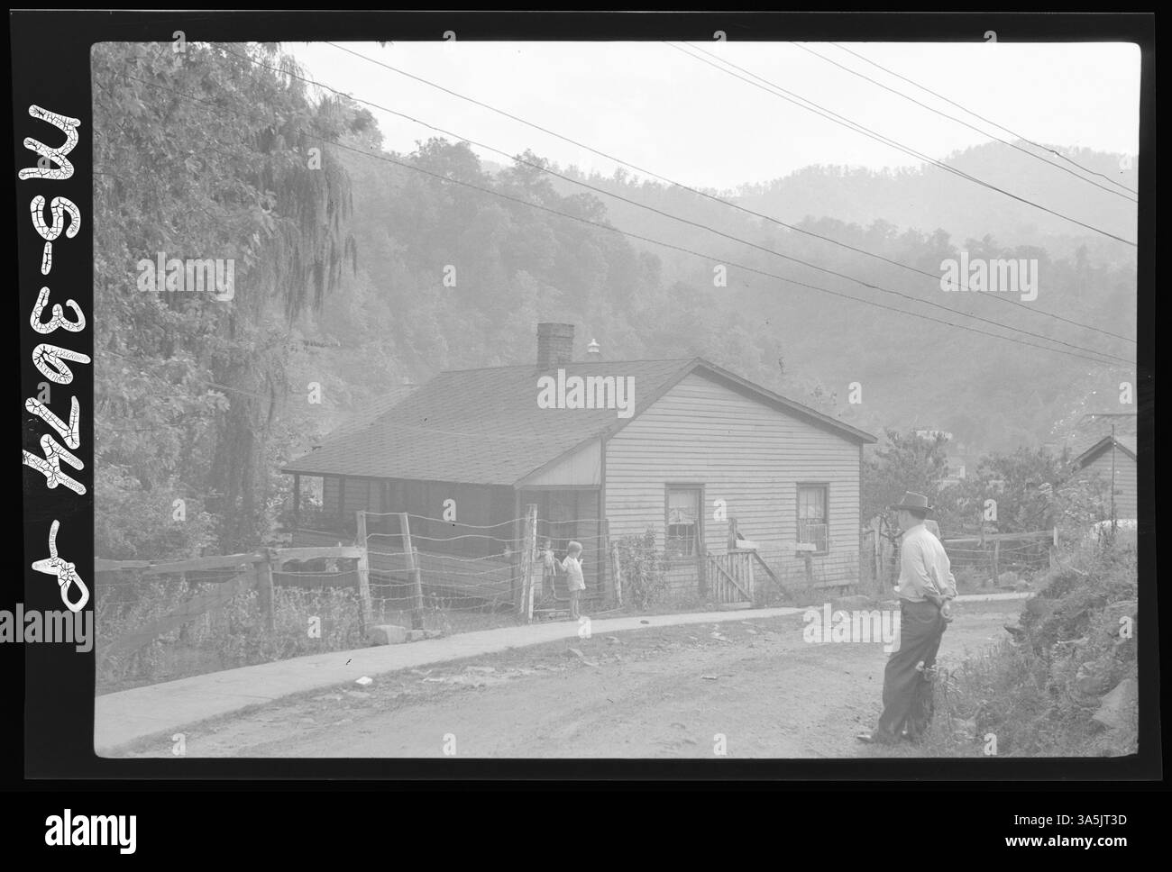 This photograph depicts House #12 in Coxton Camp, a company housing ...