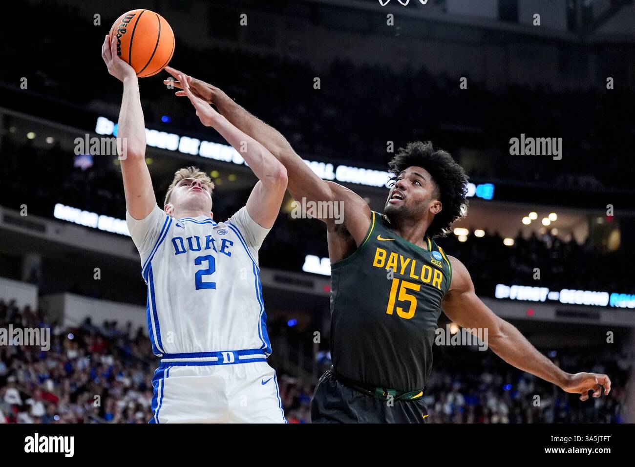 Duke forward Cooper Flagg shoots over Baylor forward Norchad Omier ...