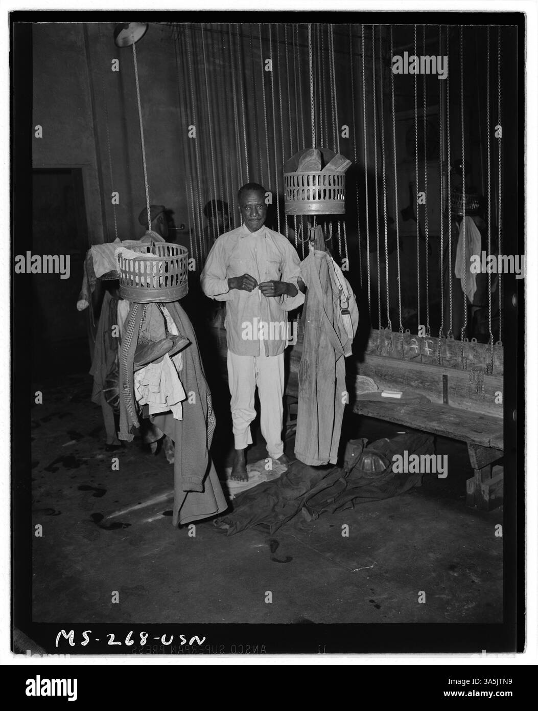 A miner dressing into street clothes in the wash and change house at H ...