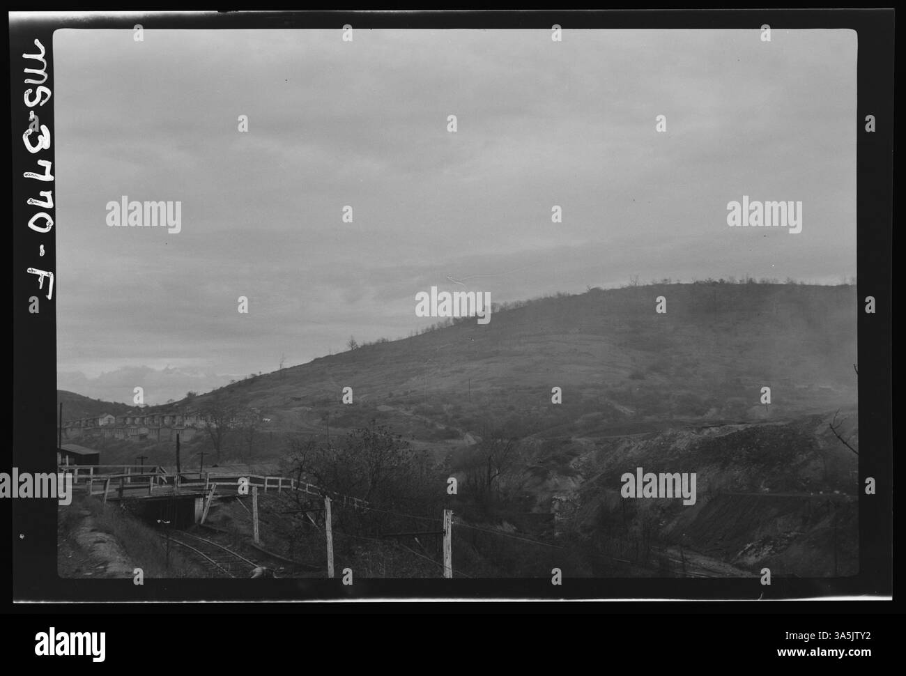 A view of the garbage pile and company house at the Louise Mine in ...