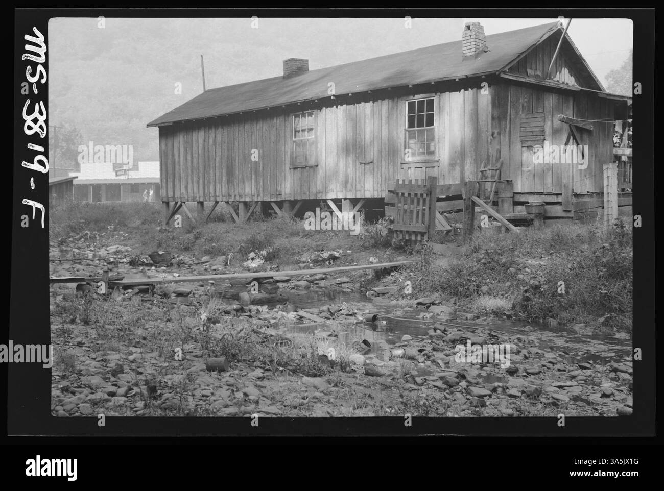 This photograph shows a typical house in a mining community, offering a ...