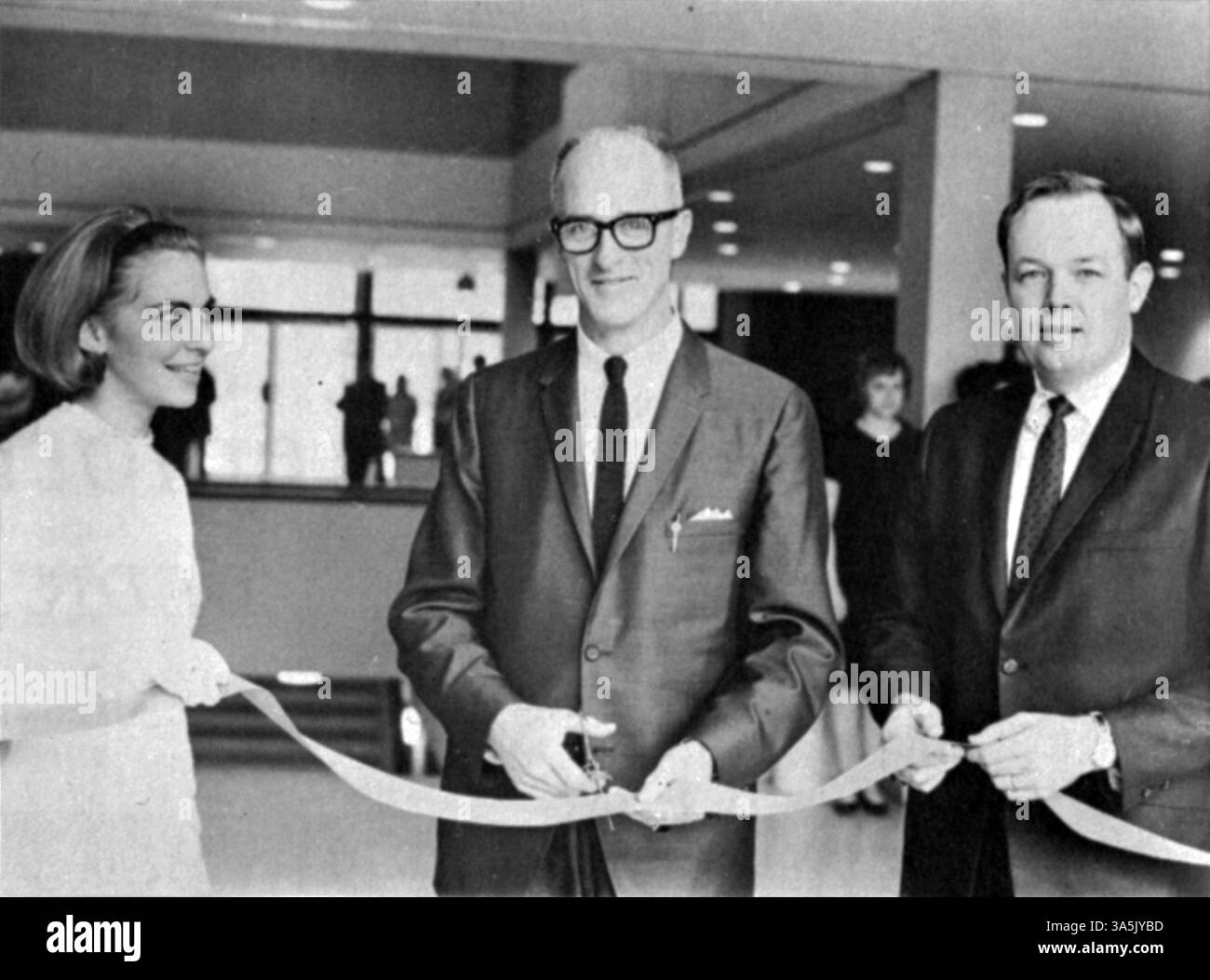 Sarah Shogren, George Budd, and Robert Benson are pictured cutting the ...