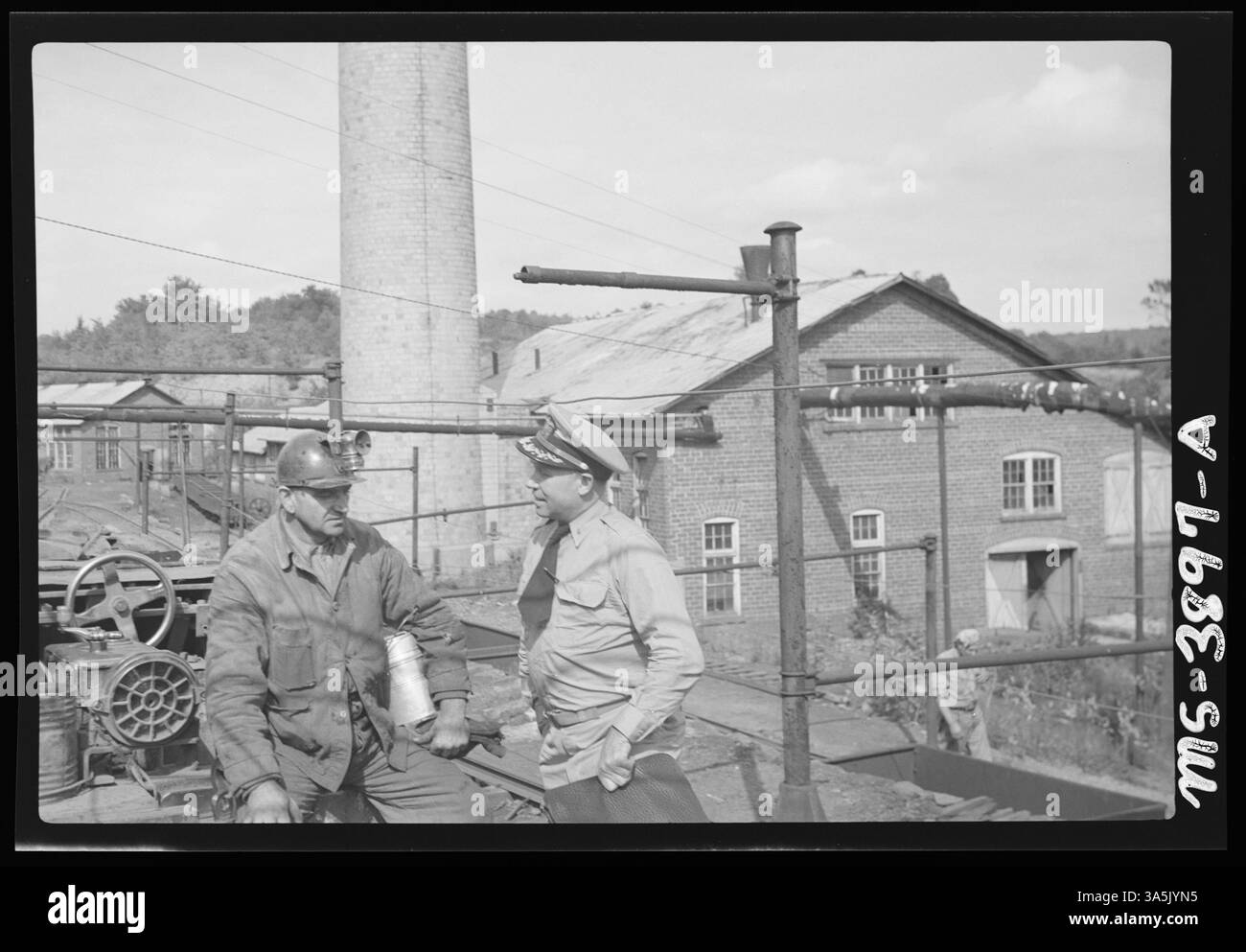 Commander J.M. Amberson (USNR) interviewing Mr. Mike Klemek, president ...