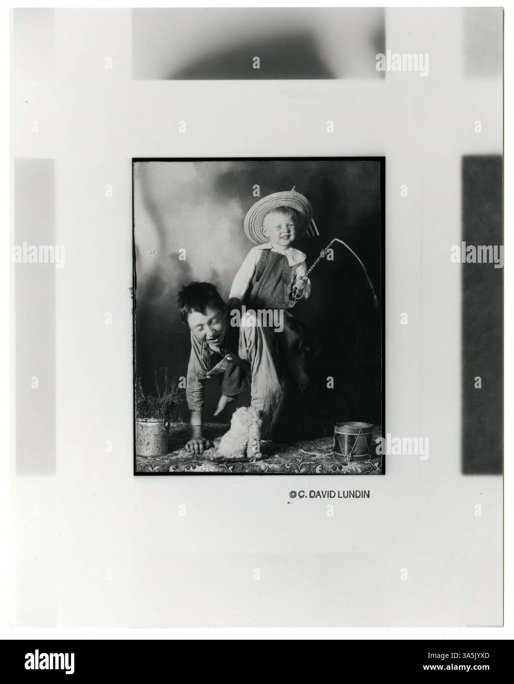 Portrait of Richard Erickson and 3-year-old Dwight Holcombe, playing ...