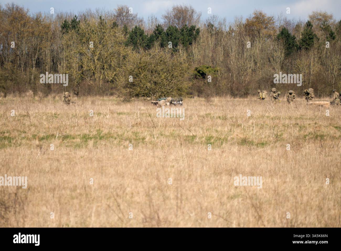 British army infantry soldiers moving across open countryside Stock ...