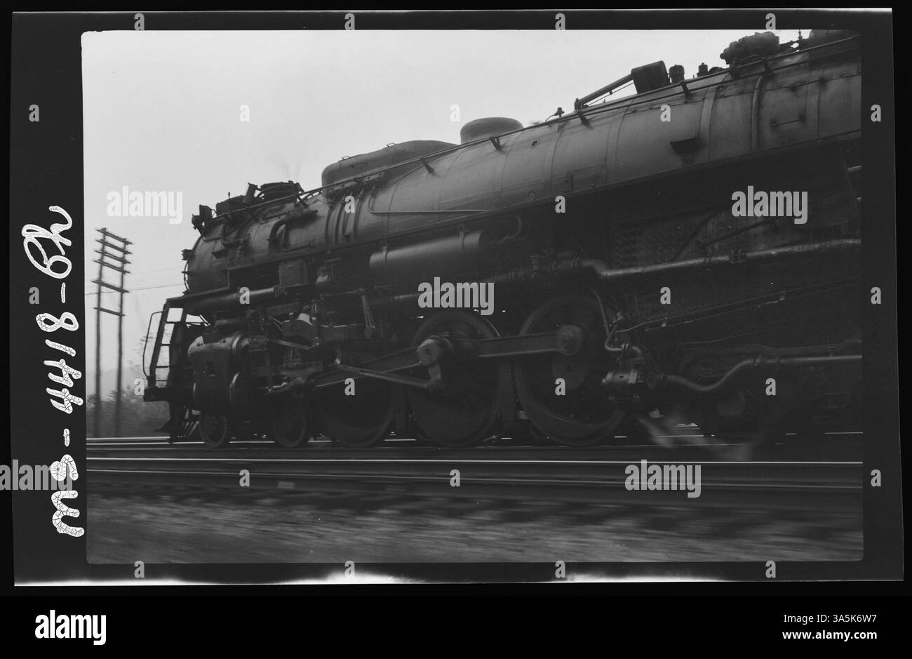 A moving train in 1946, likely transporting coal or materials from a ...