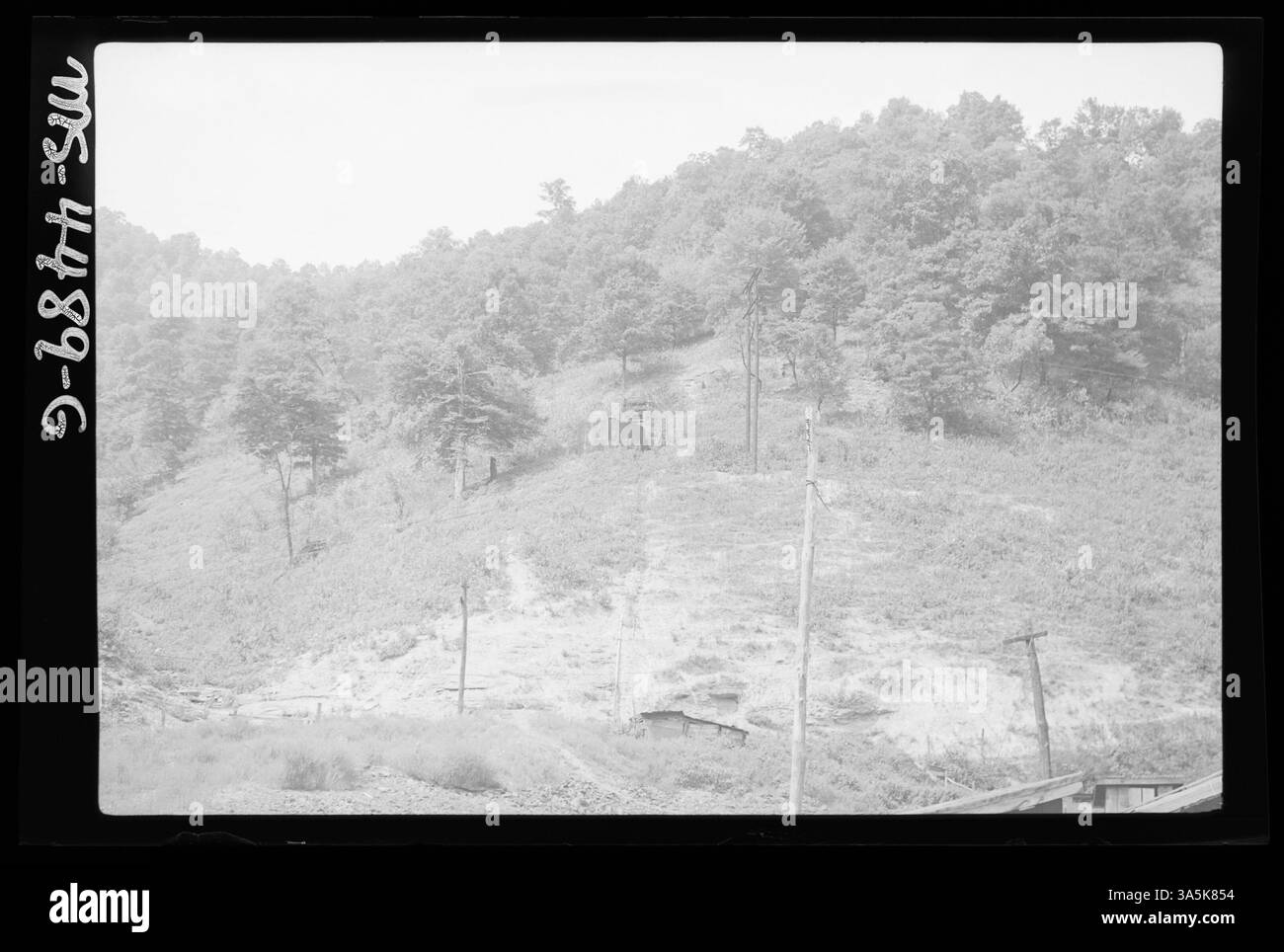 This 1946 photograph shows a water storage tank on a mountainside at ...