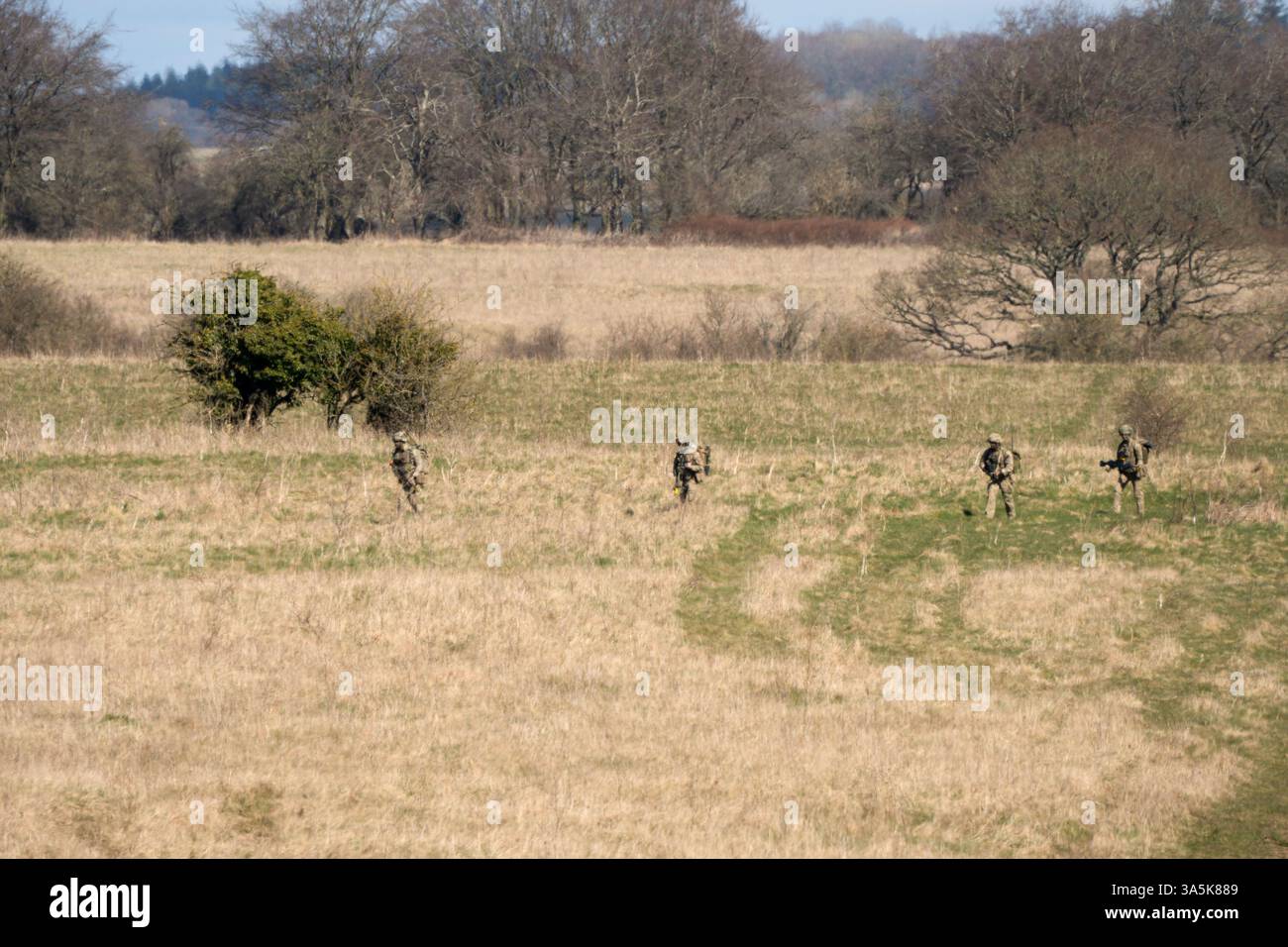 British army infantry soldiers moving across open countryside Stock ...